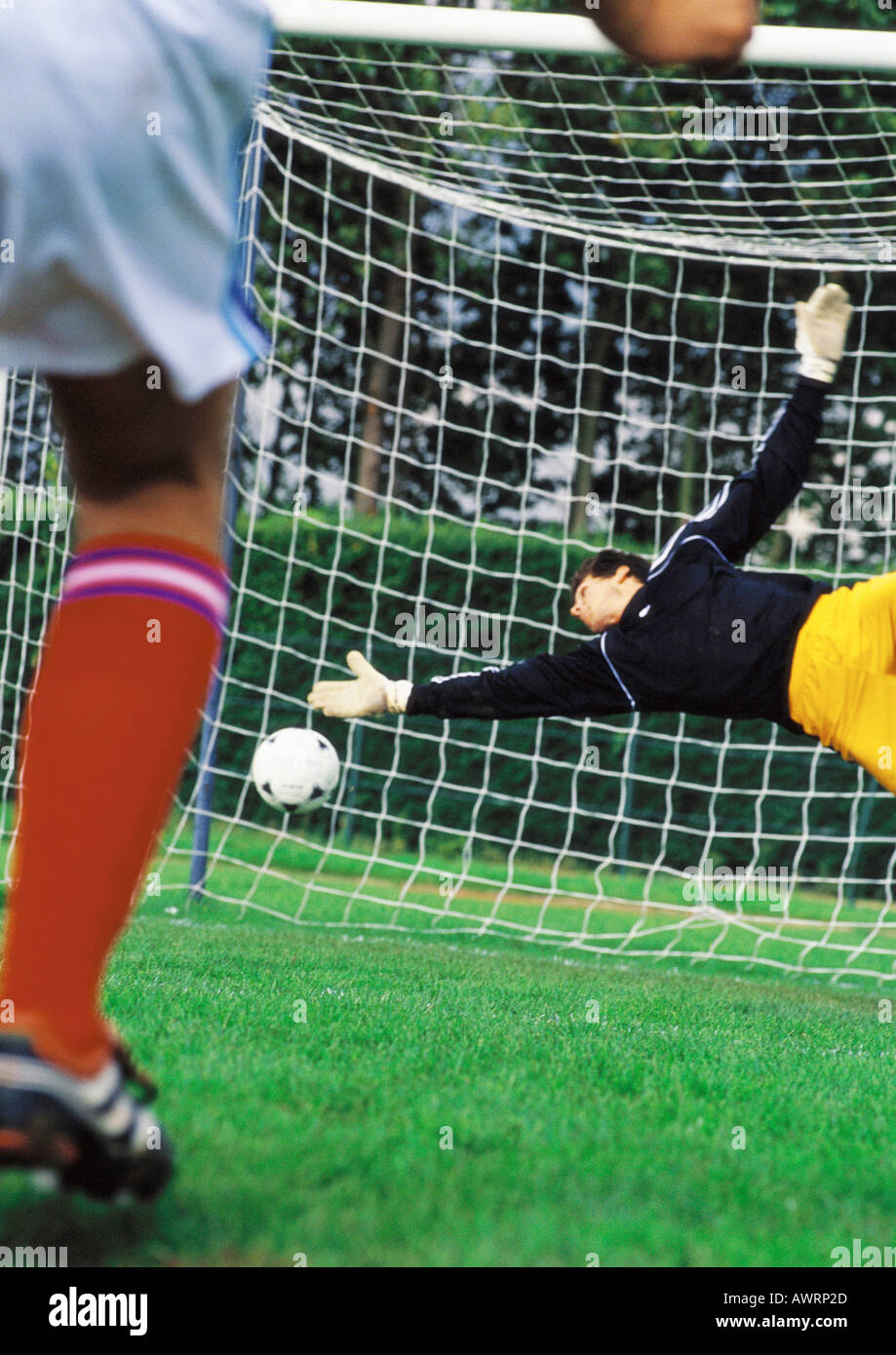 Goalkeeper catches ball saves goal hi-res stock photography and images ...