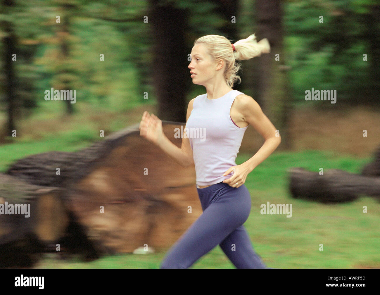 Woman running, side view Stock Photo - Alamy
