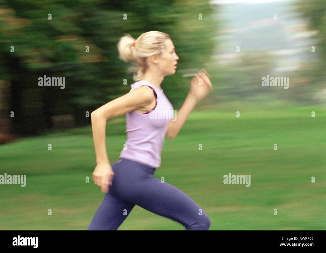 Woman running, side view, blurred Stock Photo - Alamy