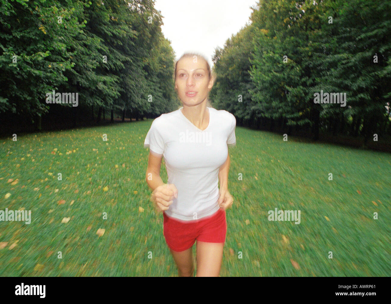 Woman running, front view Stock Photo - Alamy