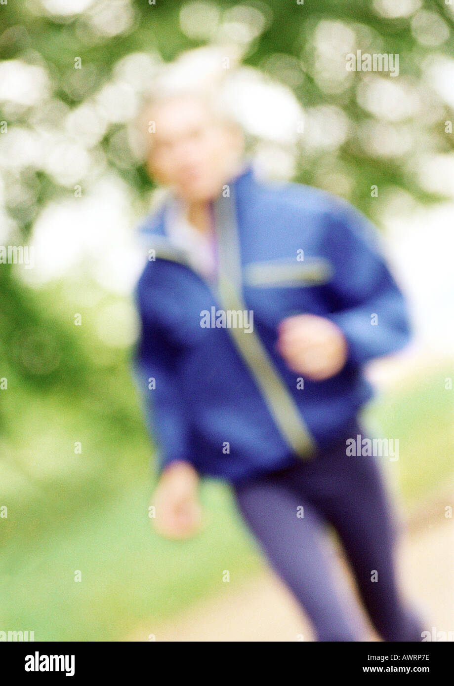 Woman running, blurred Stock Photo - Alamy