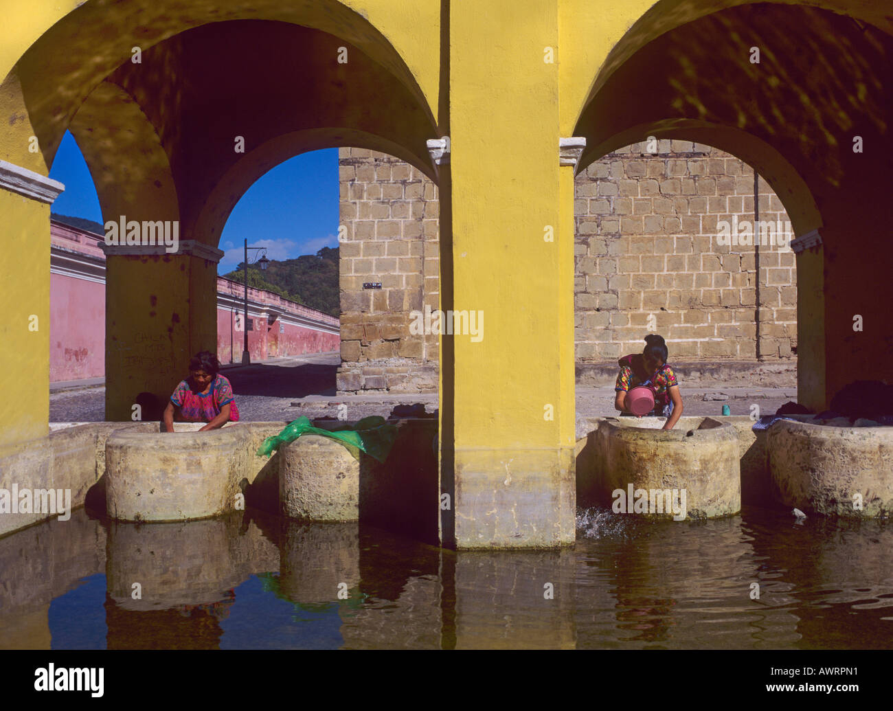 Maya women from Santa Maria de Jesus washing in the washing pila in ...