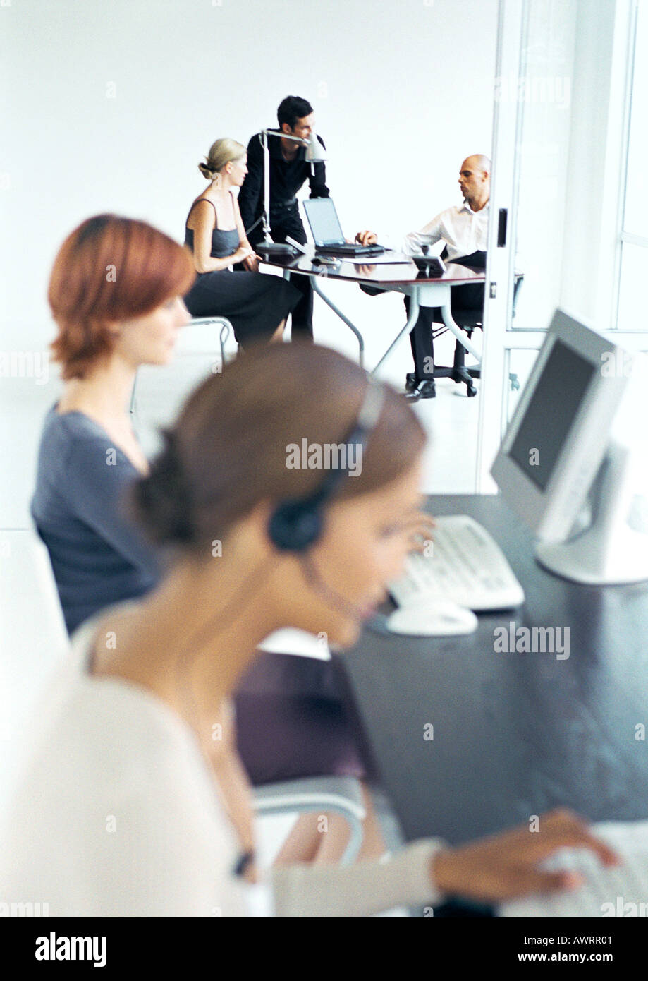 Business people in office, blurred foreground Stock Photo - Alamy