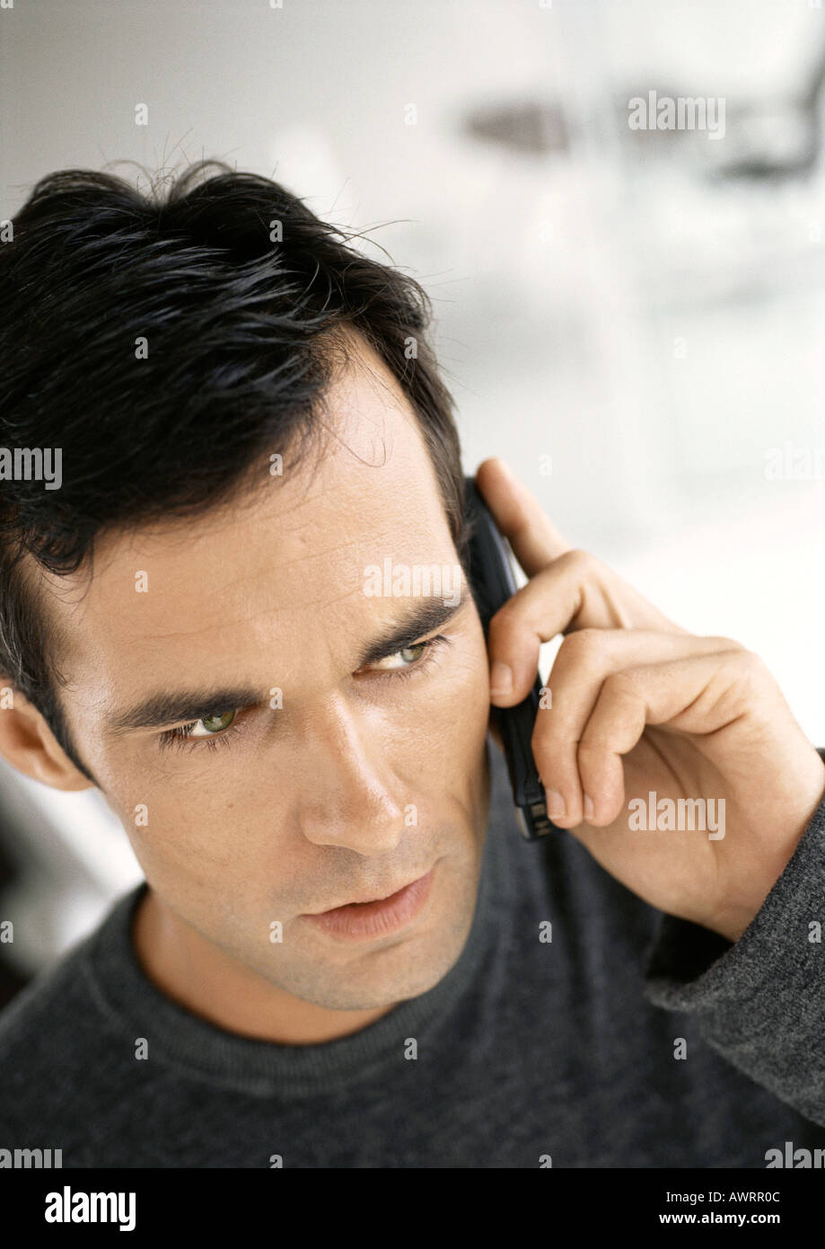 Man on phone in office concerned hi-res stock photography and images ...
