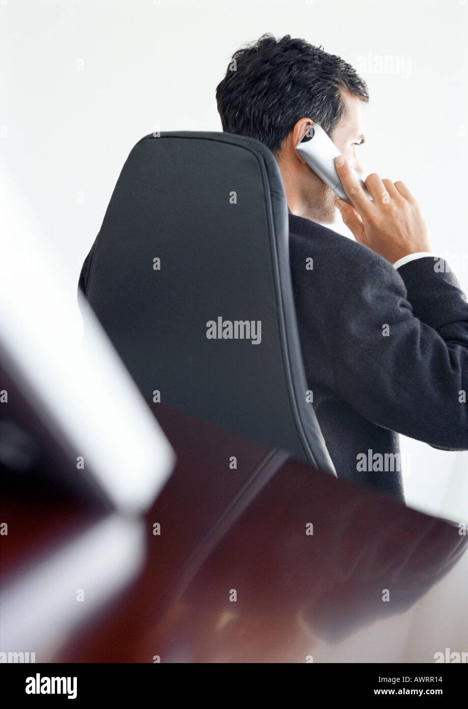 Man using mobile sitting desk hi-res stock photography and images - Alamy