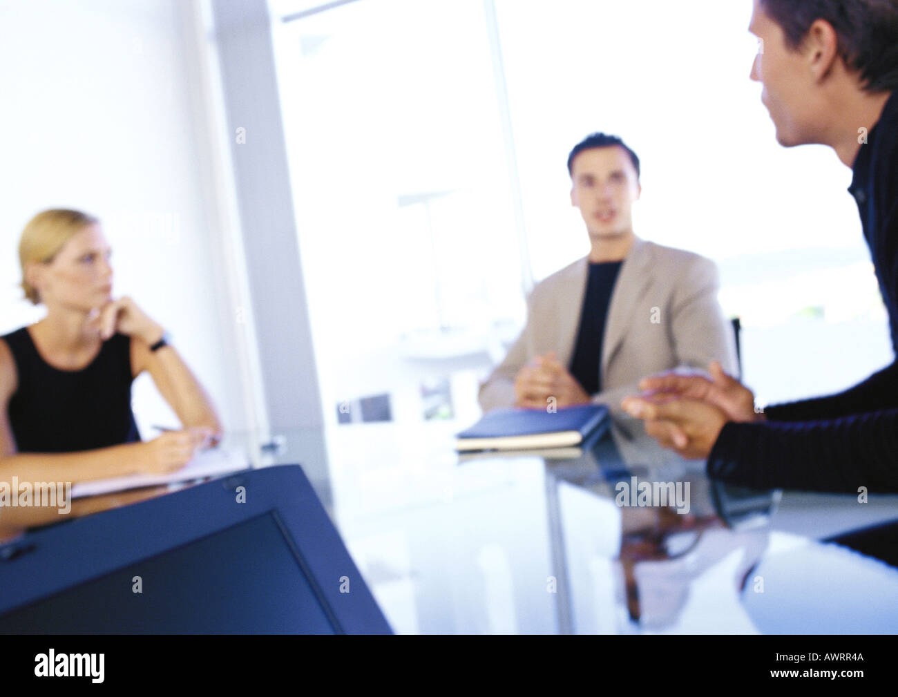 Business people sitting at desk Stock Photo - Alamy