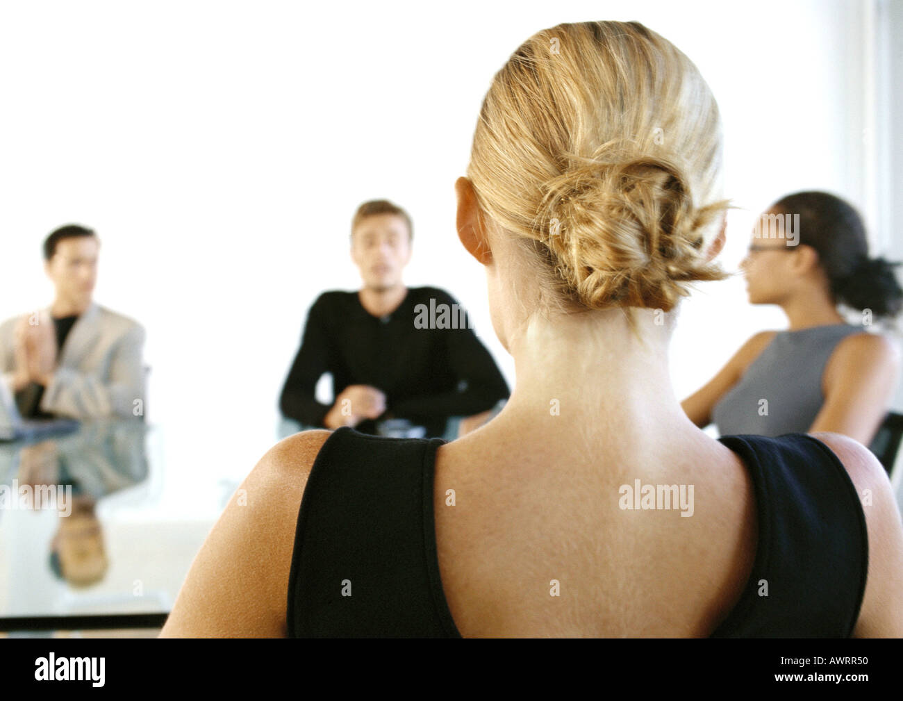 Business people sitting around table Stock Photo - Alamy