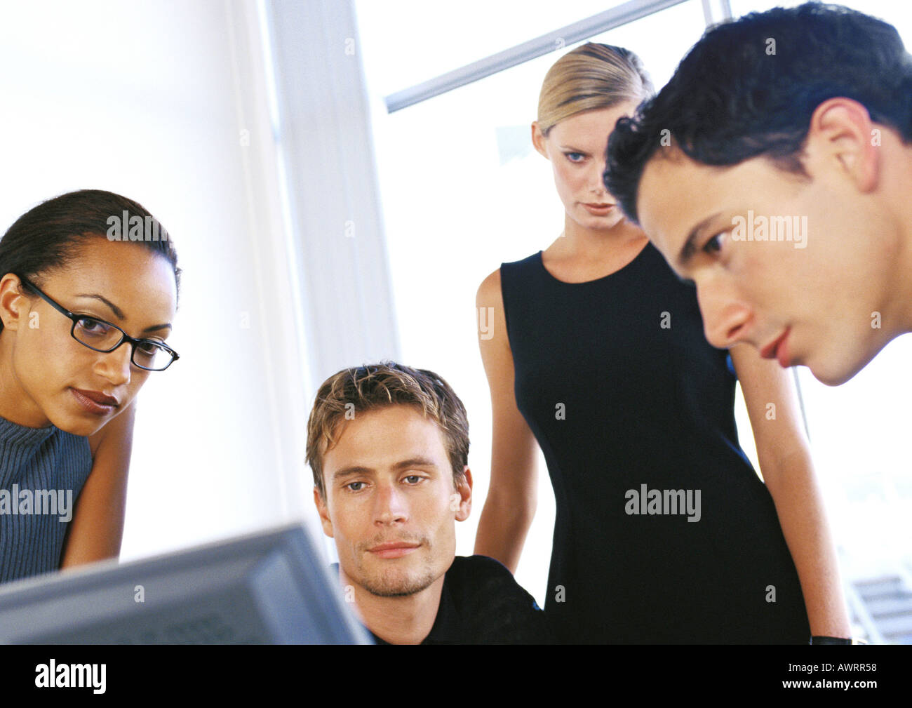 Business people looking at computer Stock Photo - Alamy