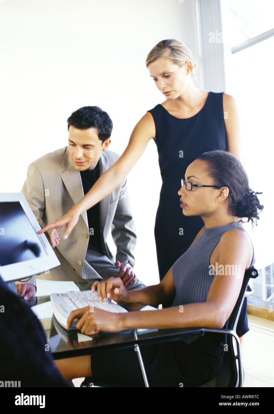 Business people looking at computer screen Stock Photo - Alamy