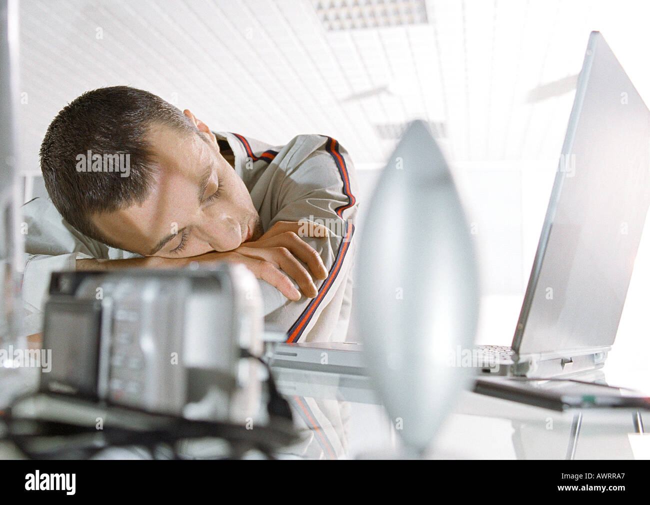 Man sleeping at desk Stock Photo - Alamy