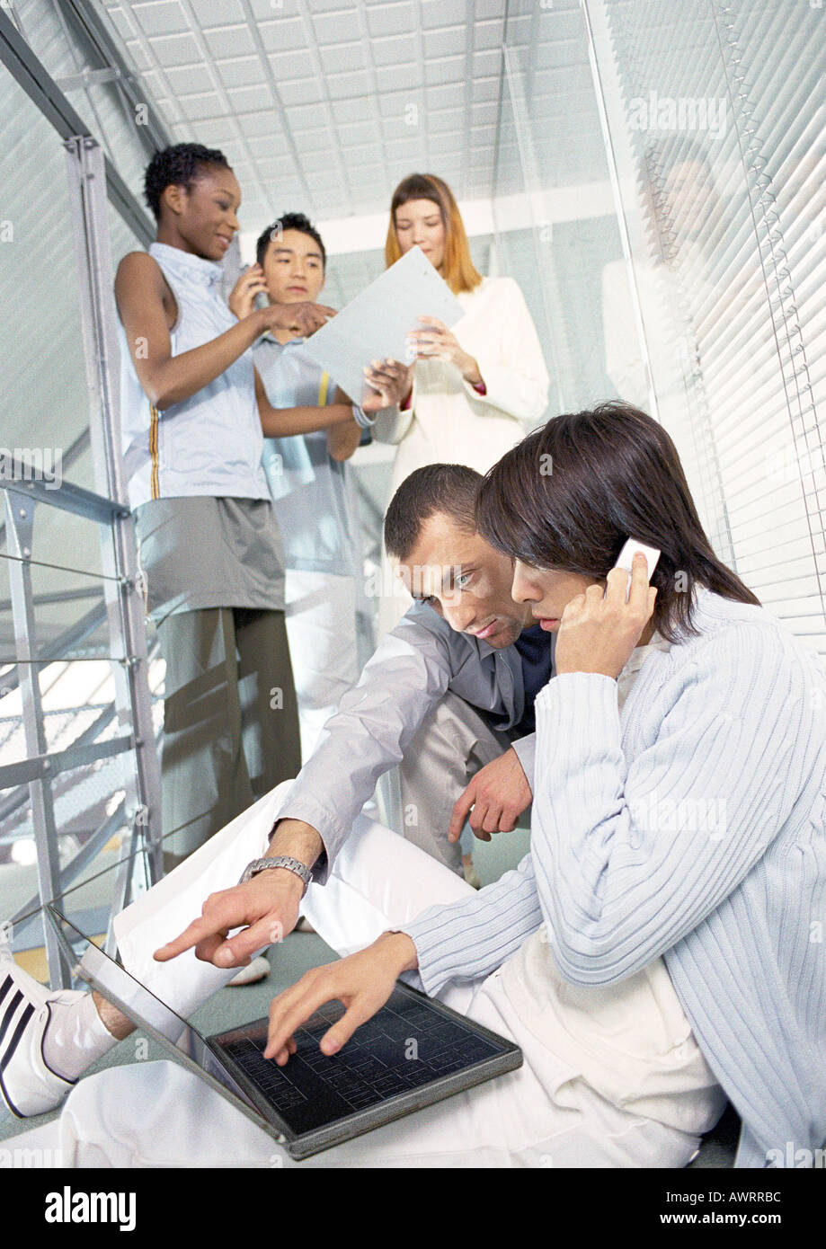 Business people working in office hallway Stock Photo - Alamy
