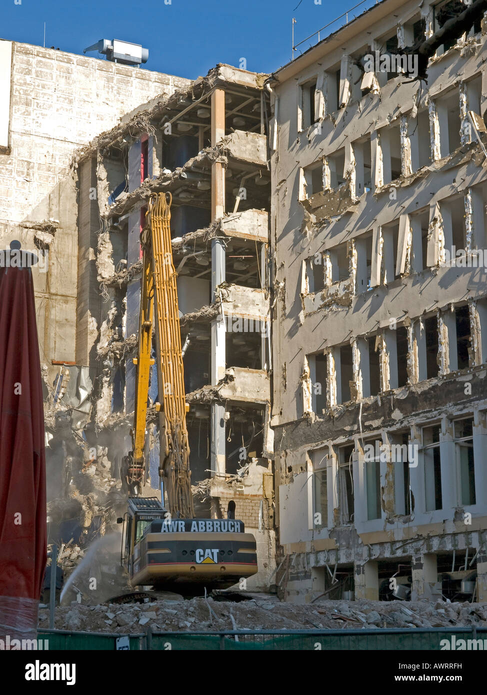 difficult demolition of a multi stored building in city breaking a ...