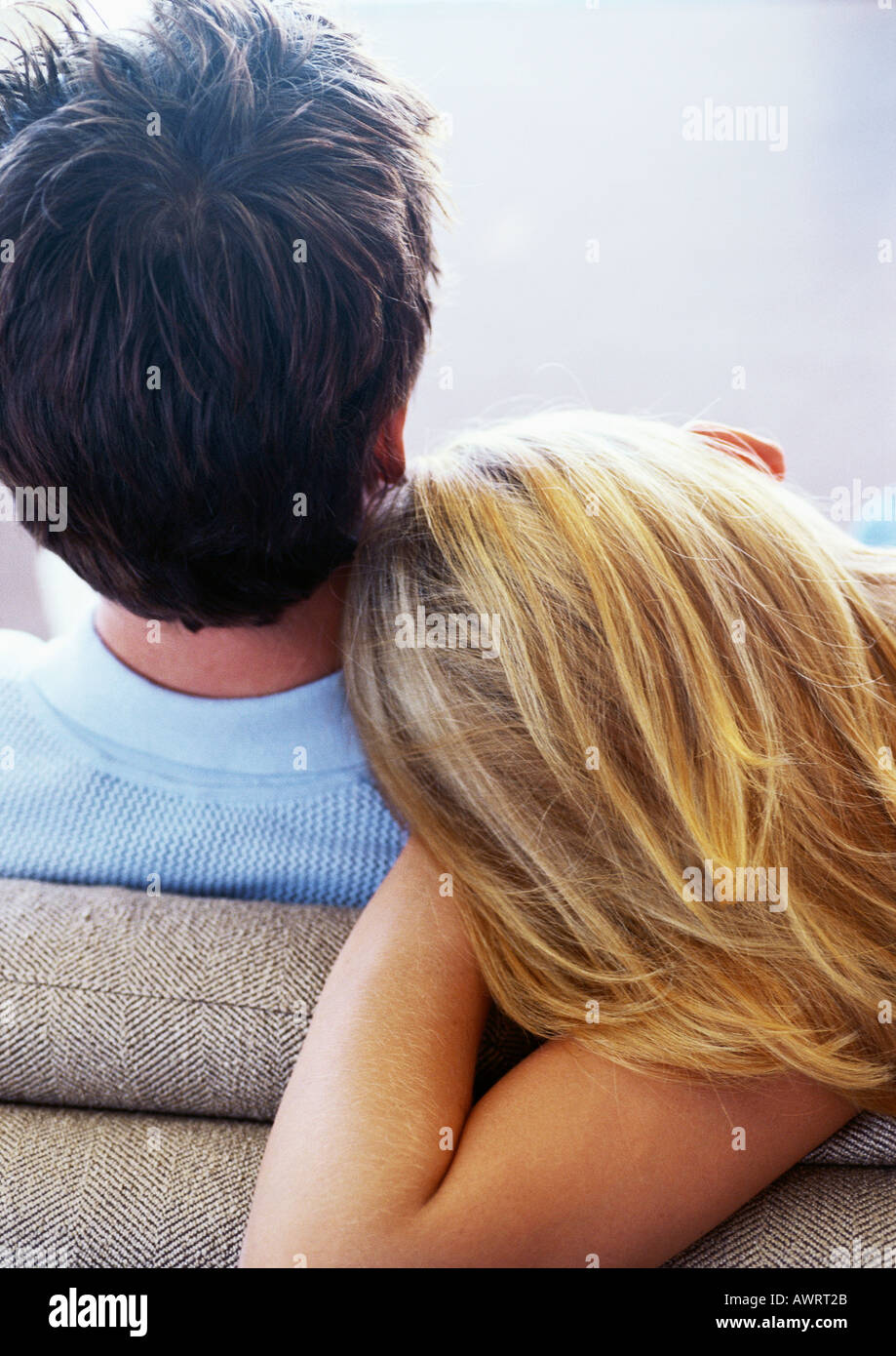 Woman resting head on man's shoulder, rear view Stock Photo - Alamy