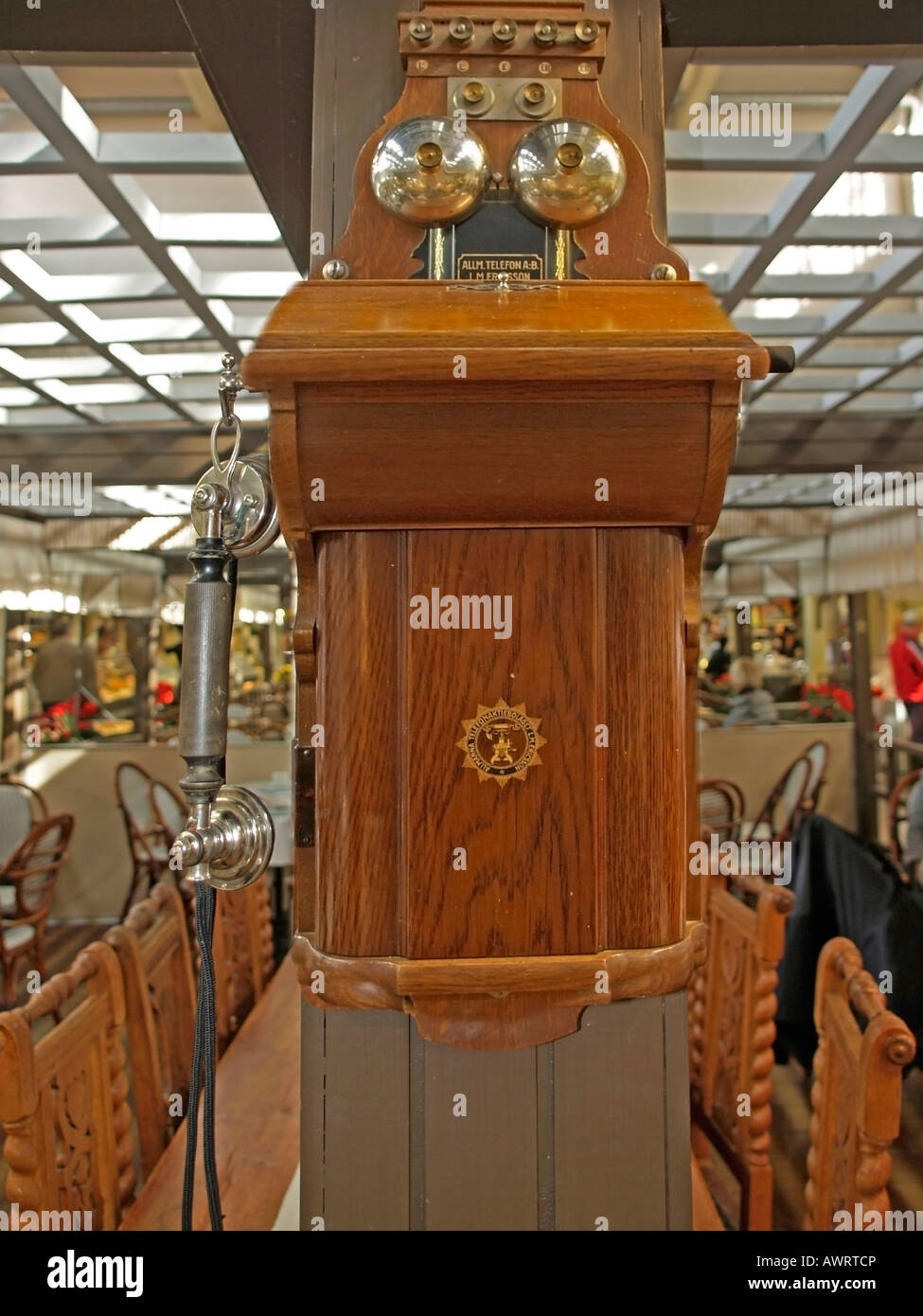 old antique wooden telephone in market hall of the town Kuopio Finland ...