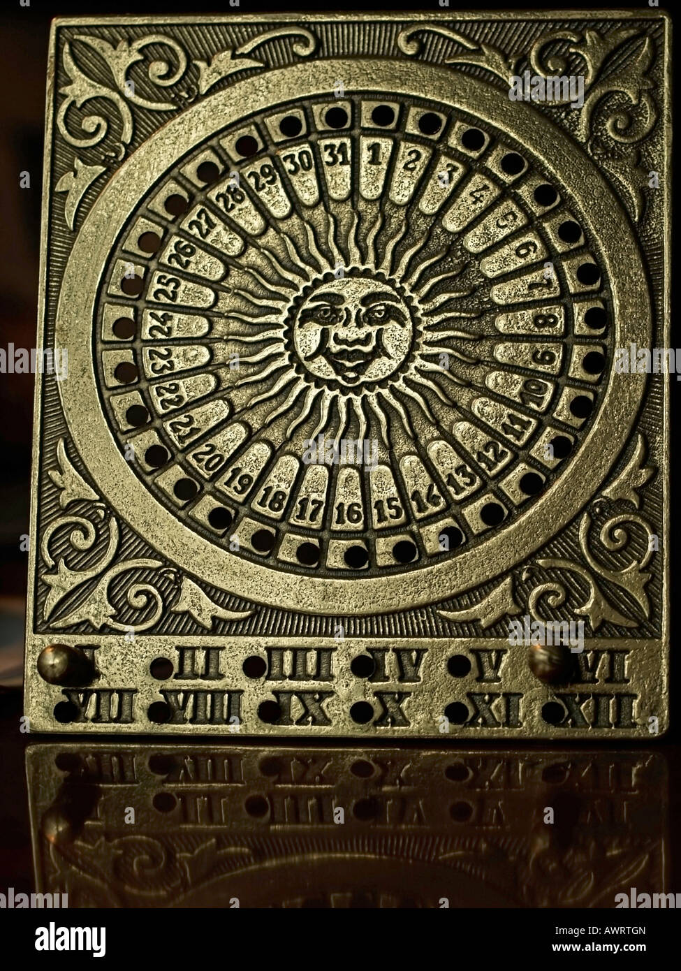 calendar for all years as brass plate with sun Stock Photo - Alamy
