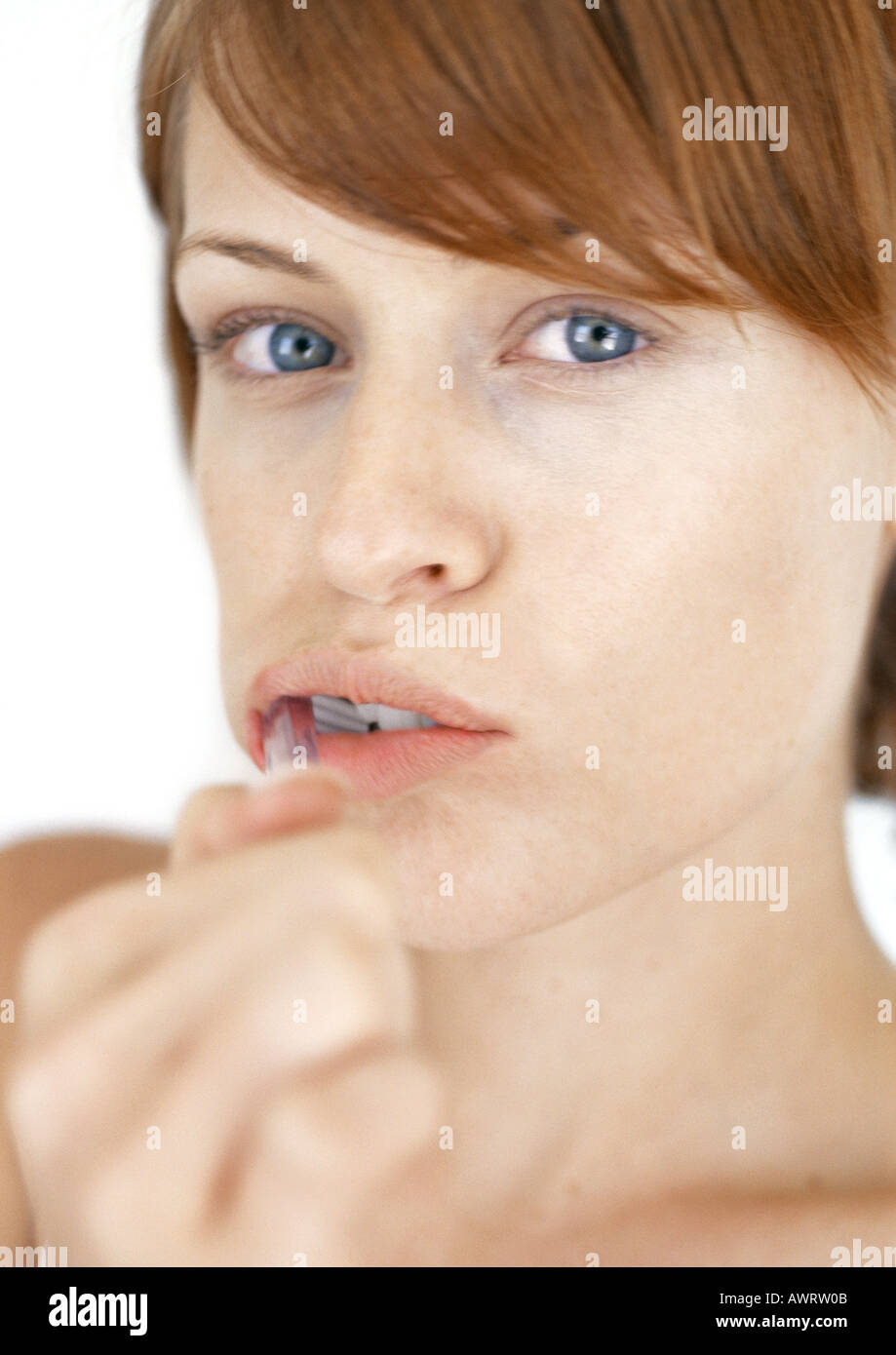 Woman brushing teeth, close-up, portrait Stock Photo - Alamy