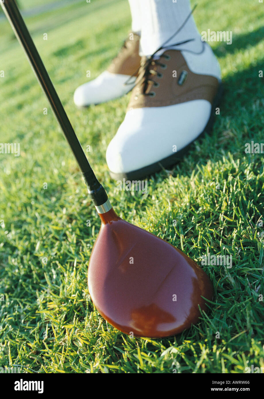 Golfer's feet and club, close-up Stock Photo - Alamy