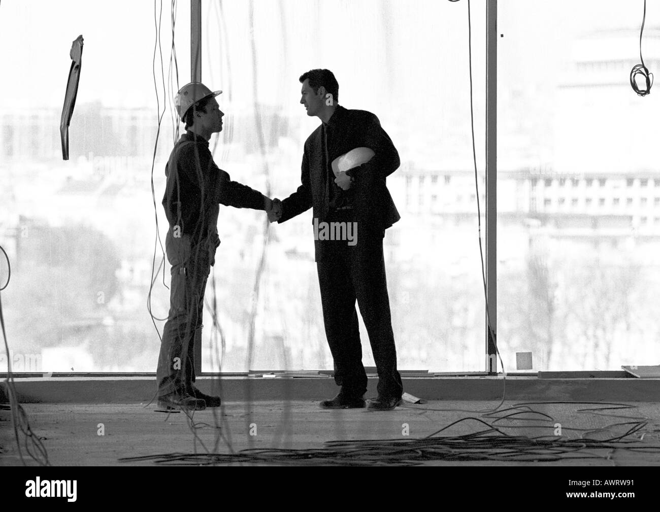 Teams shaking hands Black and White Stock Photos & Images - Alamy