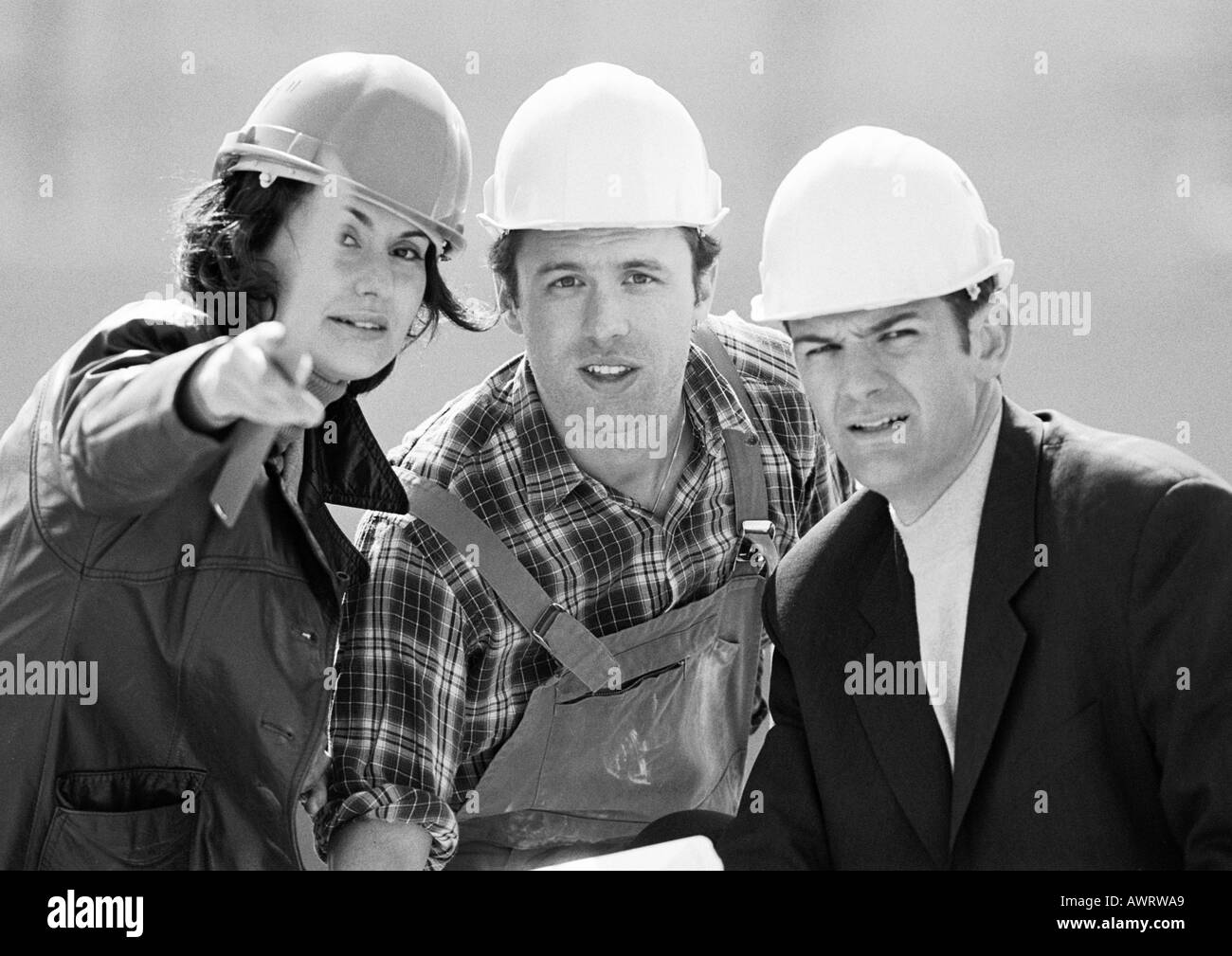 Two men point black Black and White Stock Photos & Images - Alamy