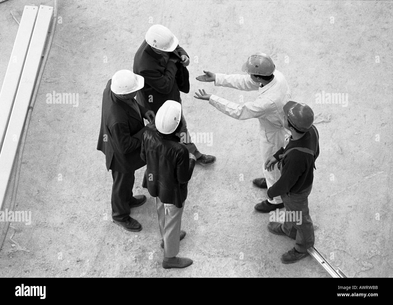 Five people wearing hard hats, elevated view, full length Stock Photo ...