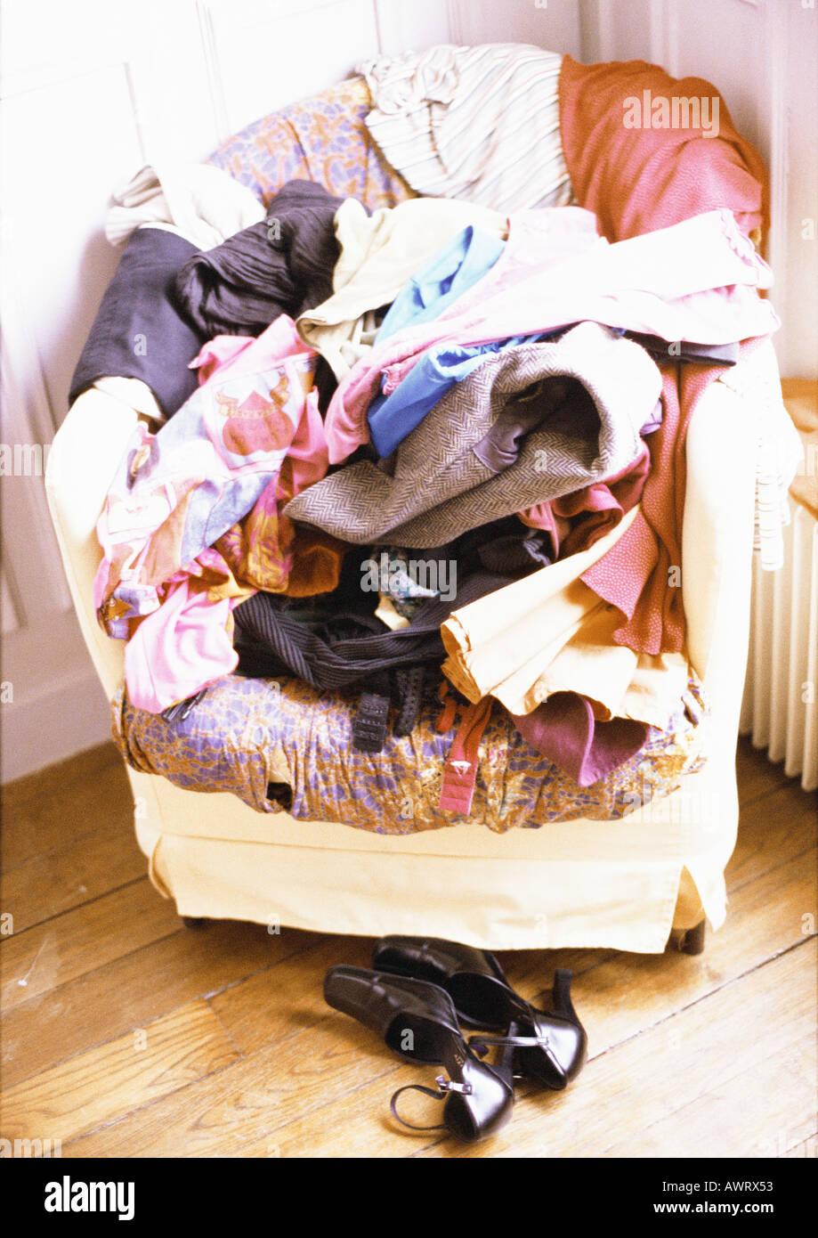 Woman and mound of clothes hi-res stock photography and images - Alamy