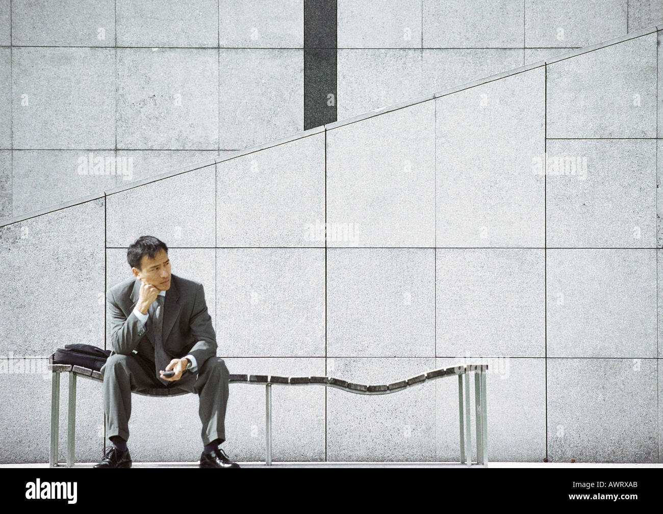 Man professional suit phone tense hi-res stock photography and images ...