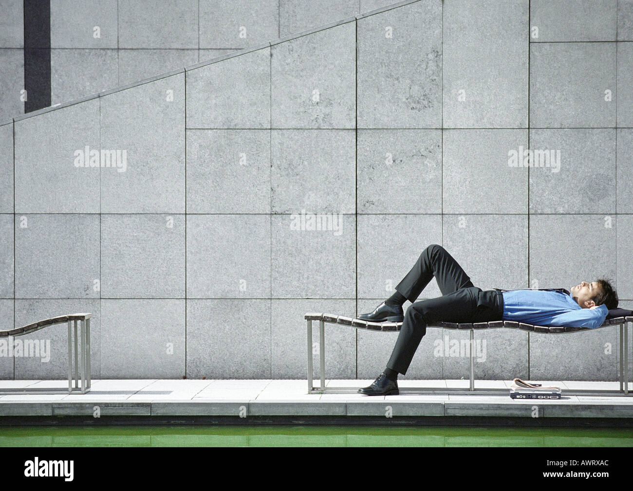 Businessman lying on bench hi-res stock photography and images - Alamy