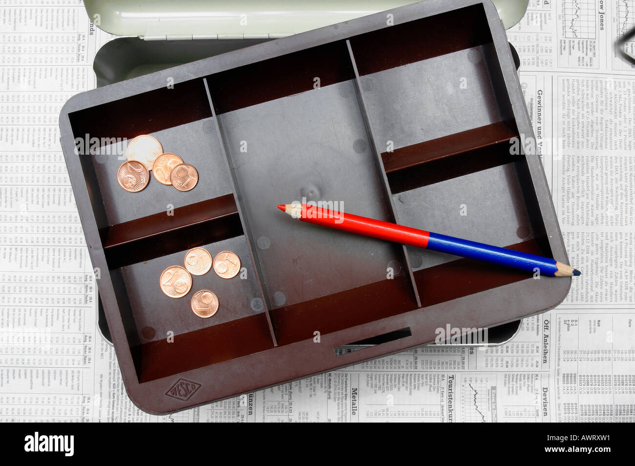 Cash box, empty, cent, coins, red pencil Stock Photo - Alamy