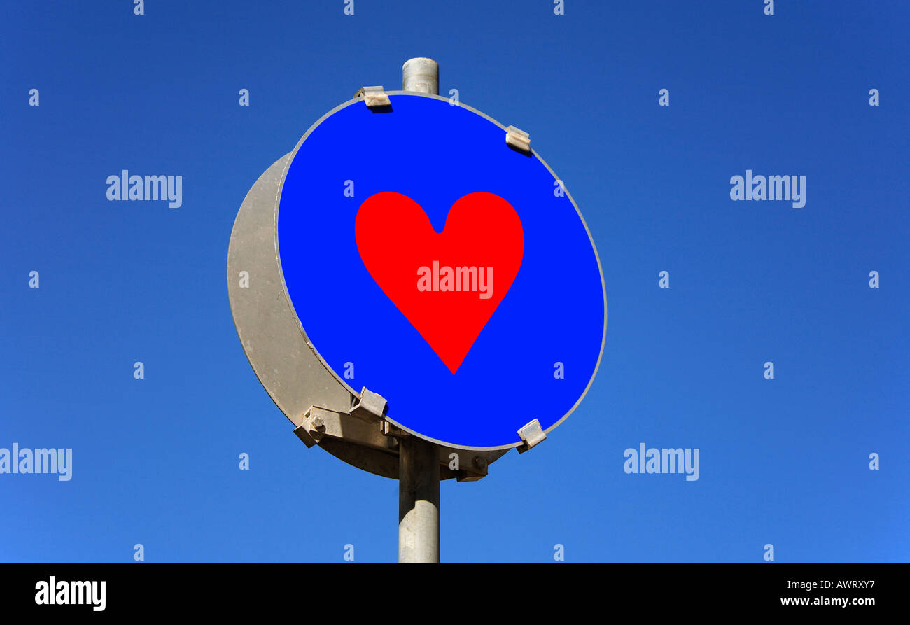 Symbolic photo - traffic sign - red heart Stock Photo - Alamy