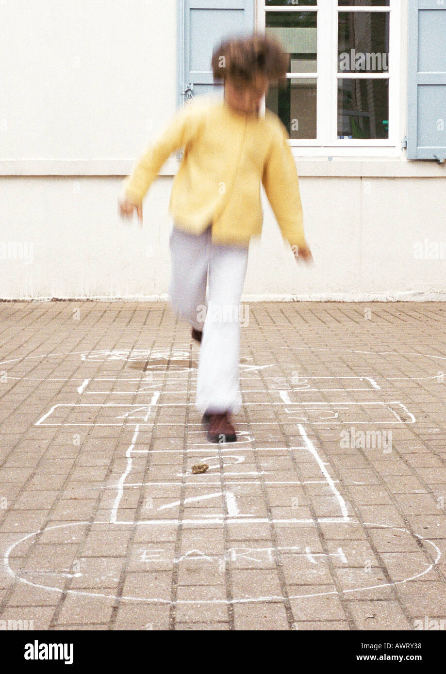 Child playing hopscotch Stock Photo - Alamy