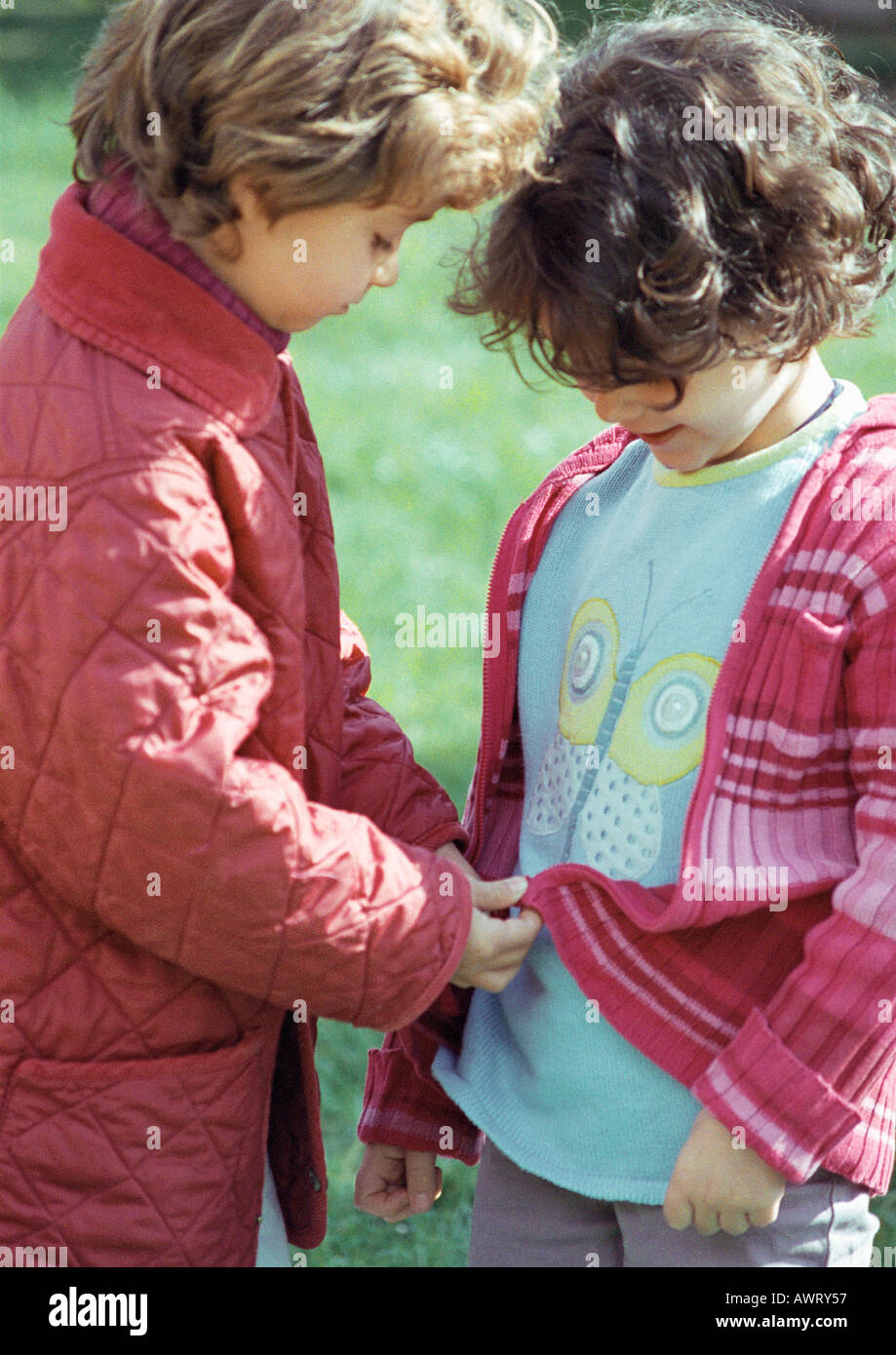 Kids helping their friend up hi-res stock photography and images - Alamy