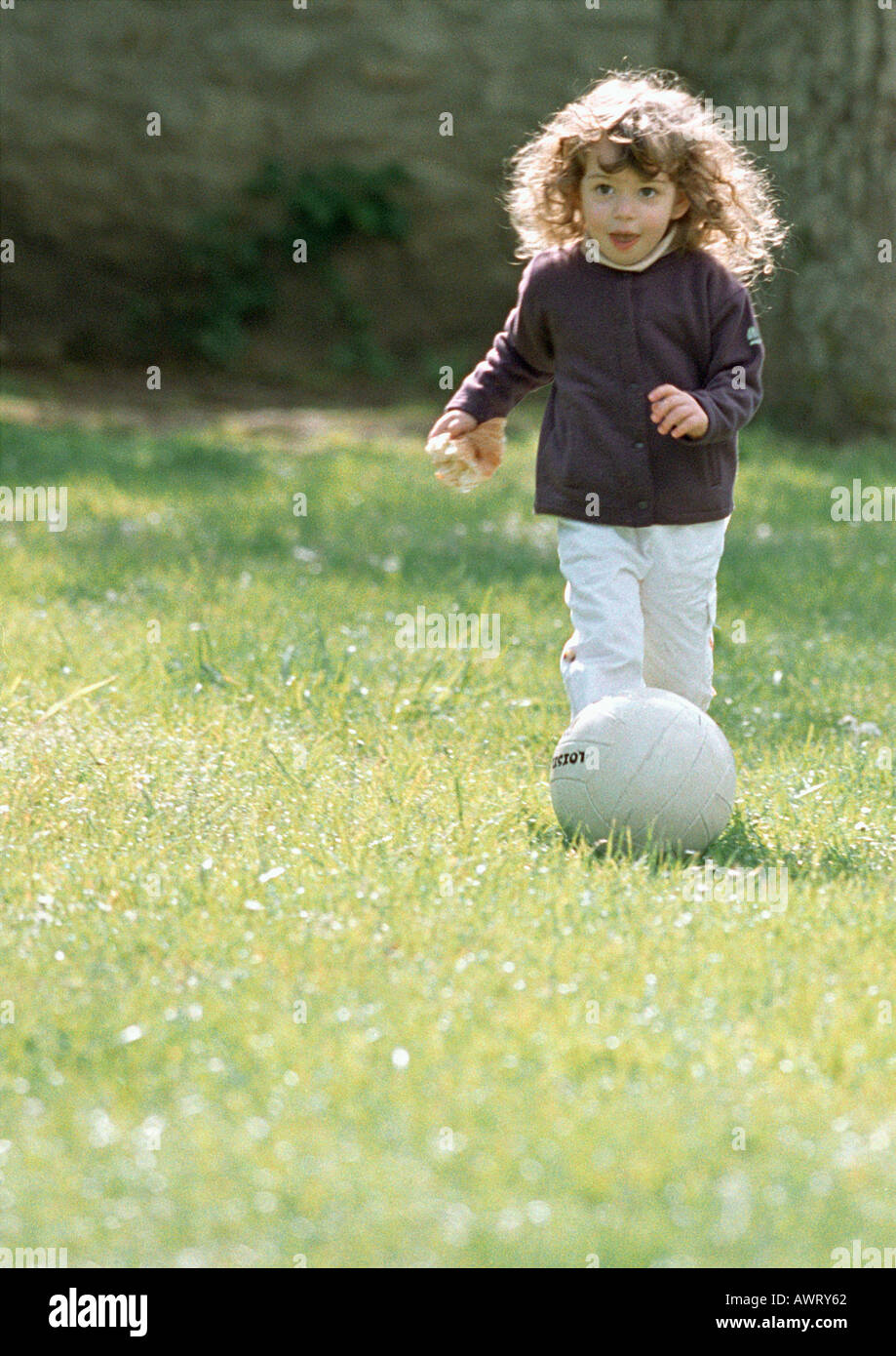 Child playing with soccer ball Stock Photo - Alamy