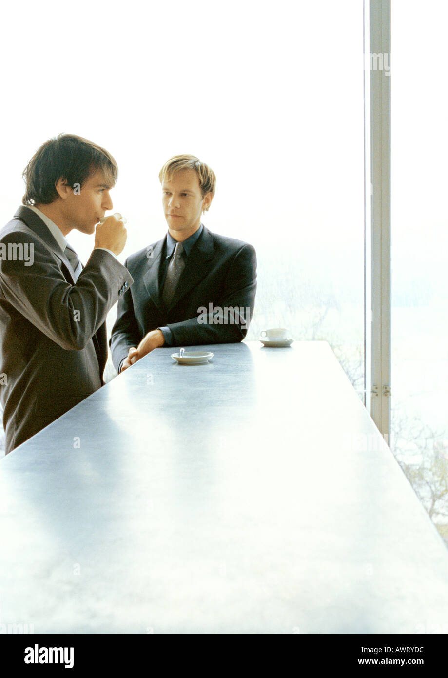 People in suits drinking coffee hi-res stock photography and images - Alamy