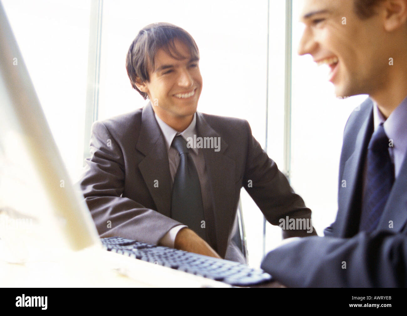 Businessmen laughing together, head and shoulders Stock Photo - Alamy