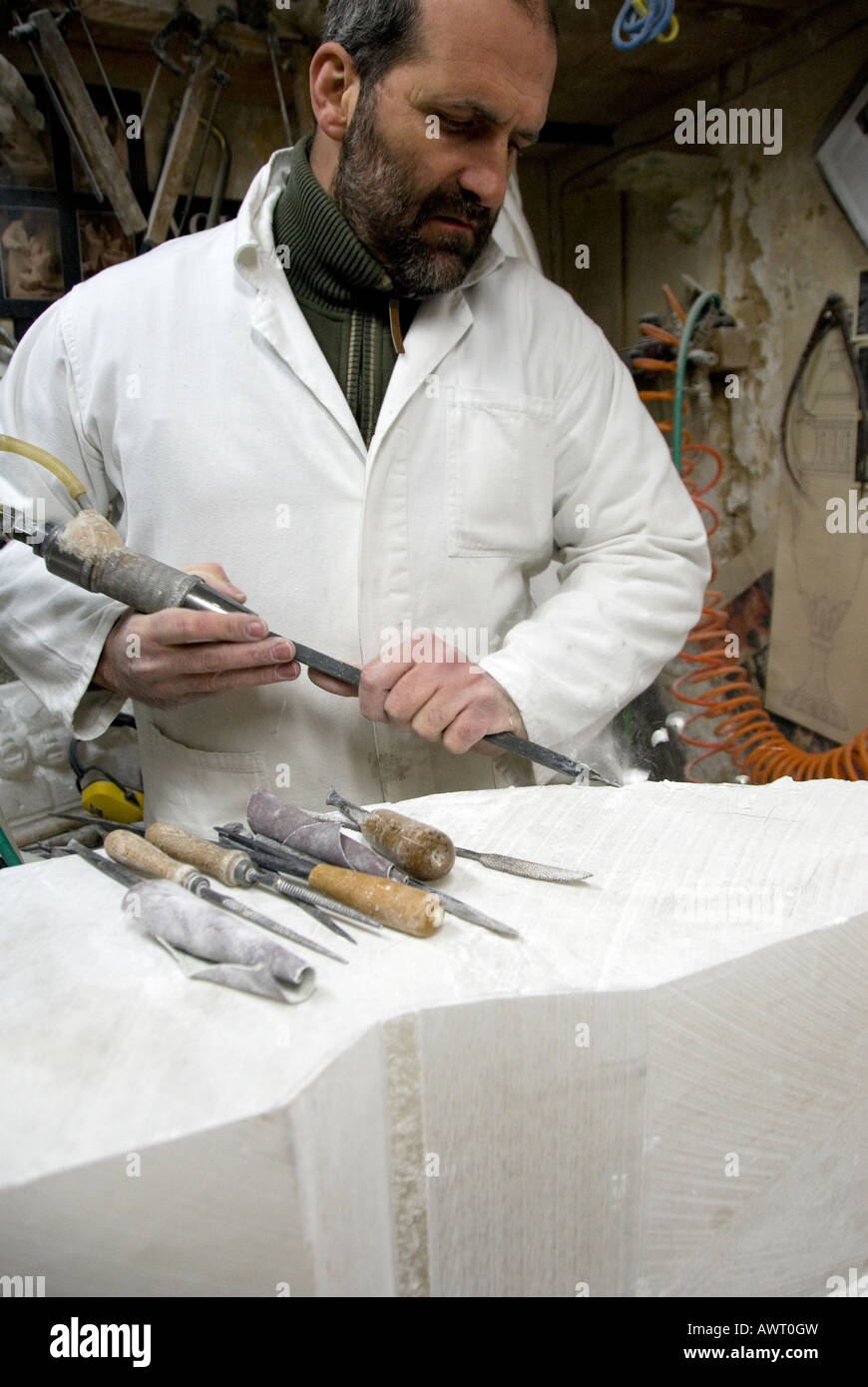 Sculptor carving a large piece of alabaster in Volterra Italy Stock ...