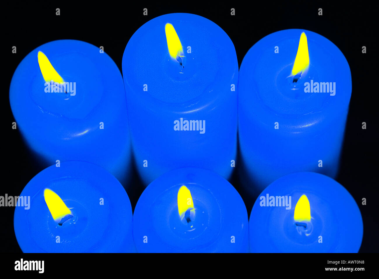 Burning blue candles Stock Photo - Alamy