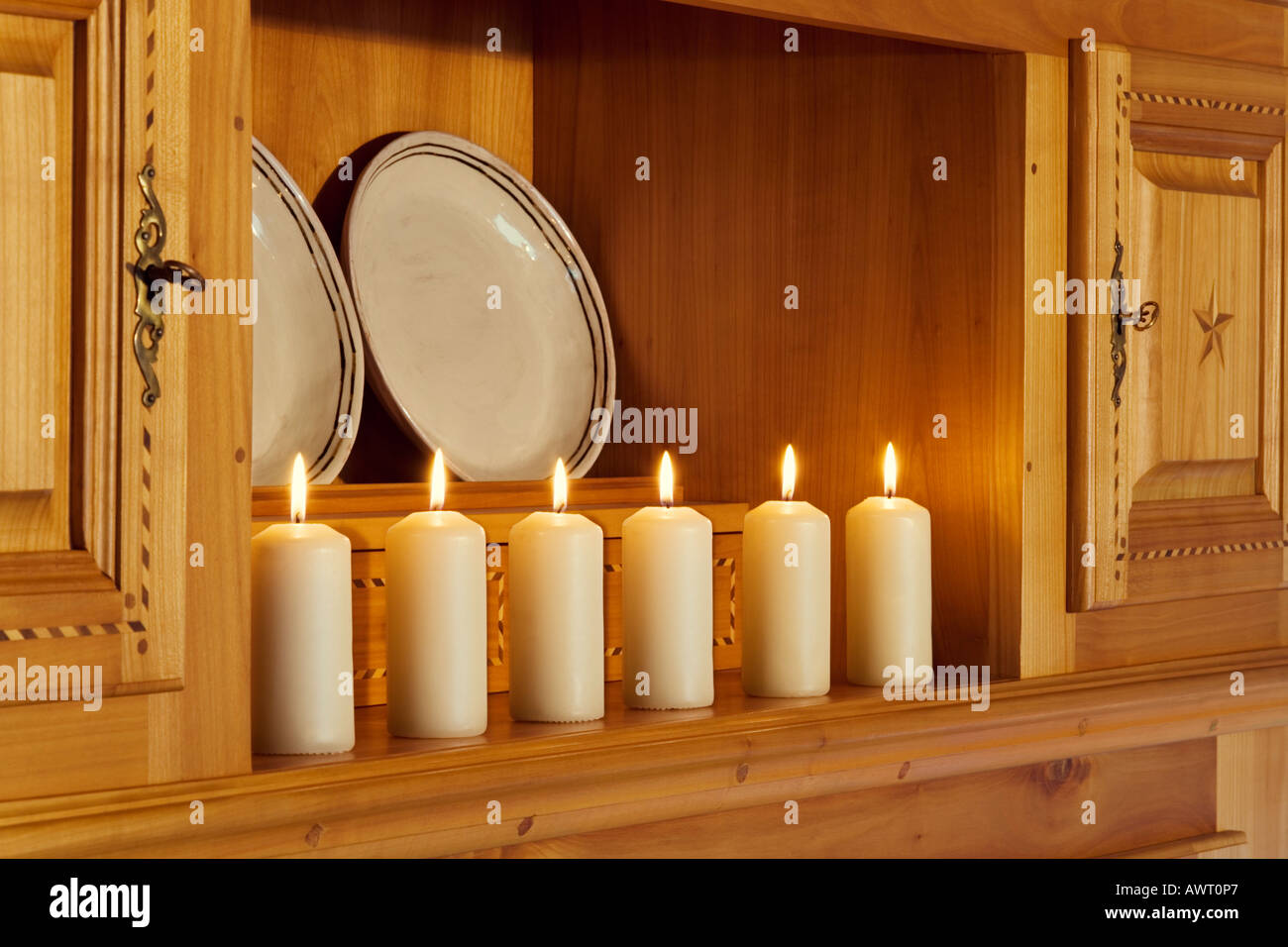 Burning white candles Stock Photo - Alamy