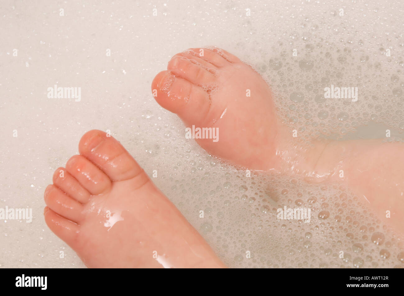 Month old baby girls feet hi-res stock photography and images - Alamy