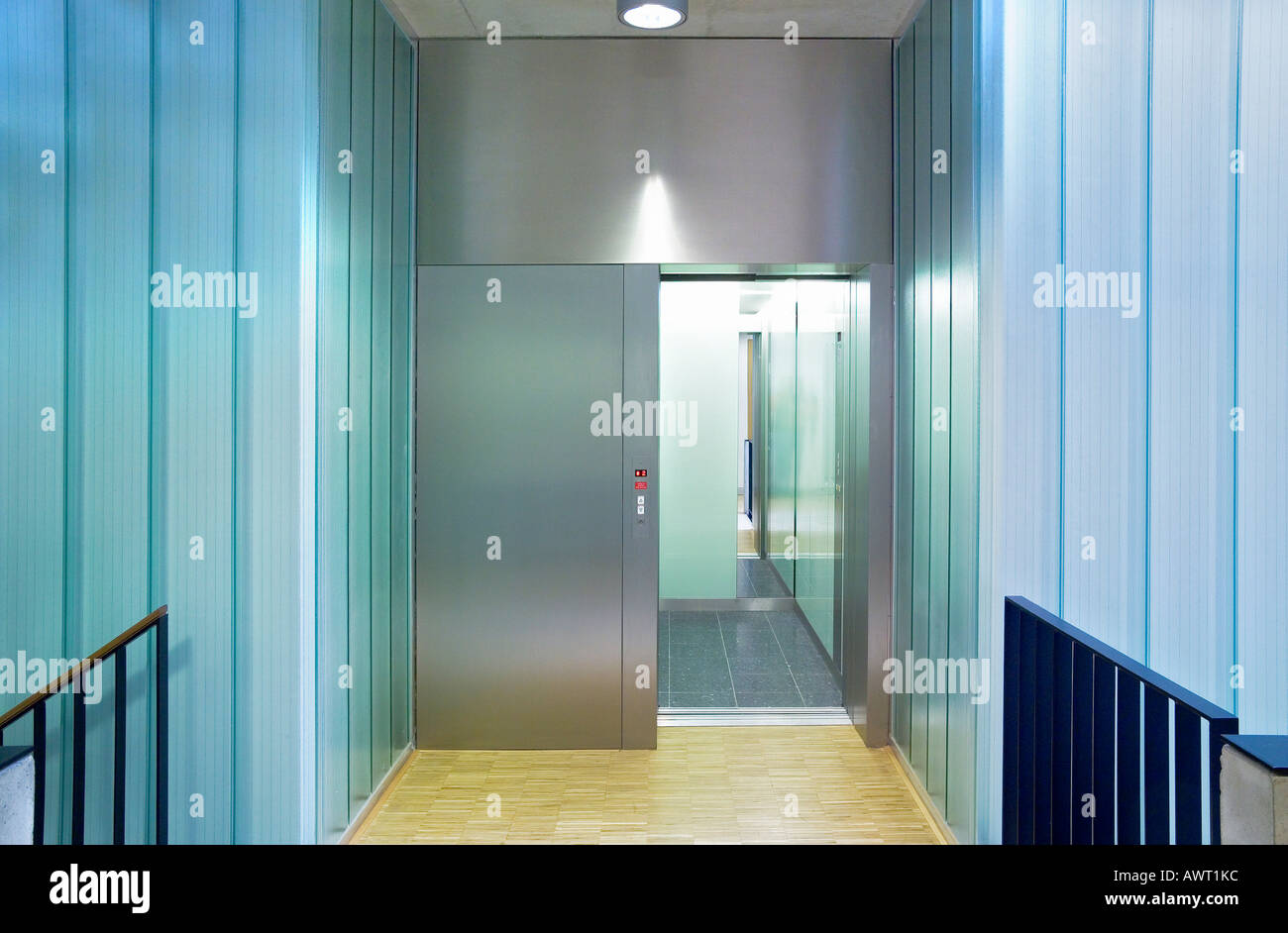 Elevator in a modern building, mixed construction material glass, wood ...