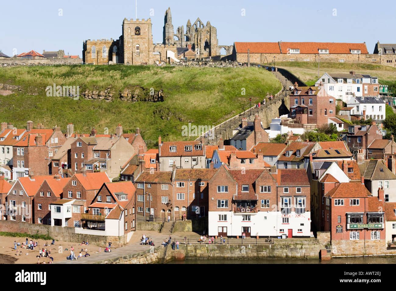 Whitby Abbey at the top of Abbey Steps above the harbour at Whitby ...