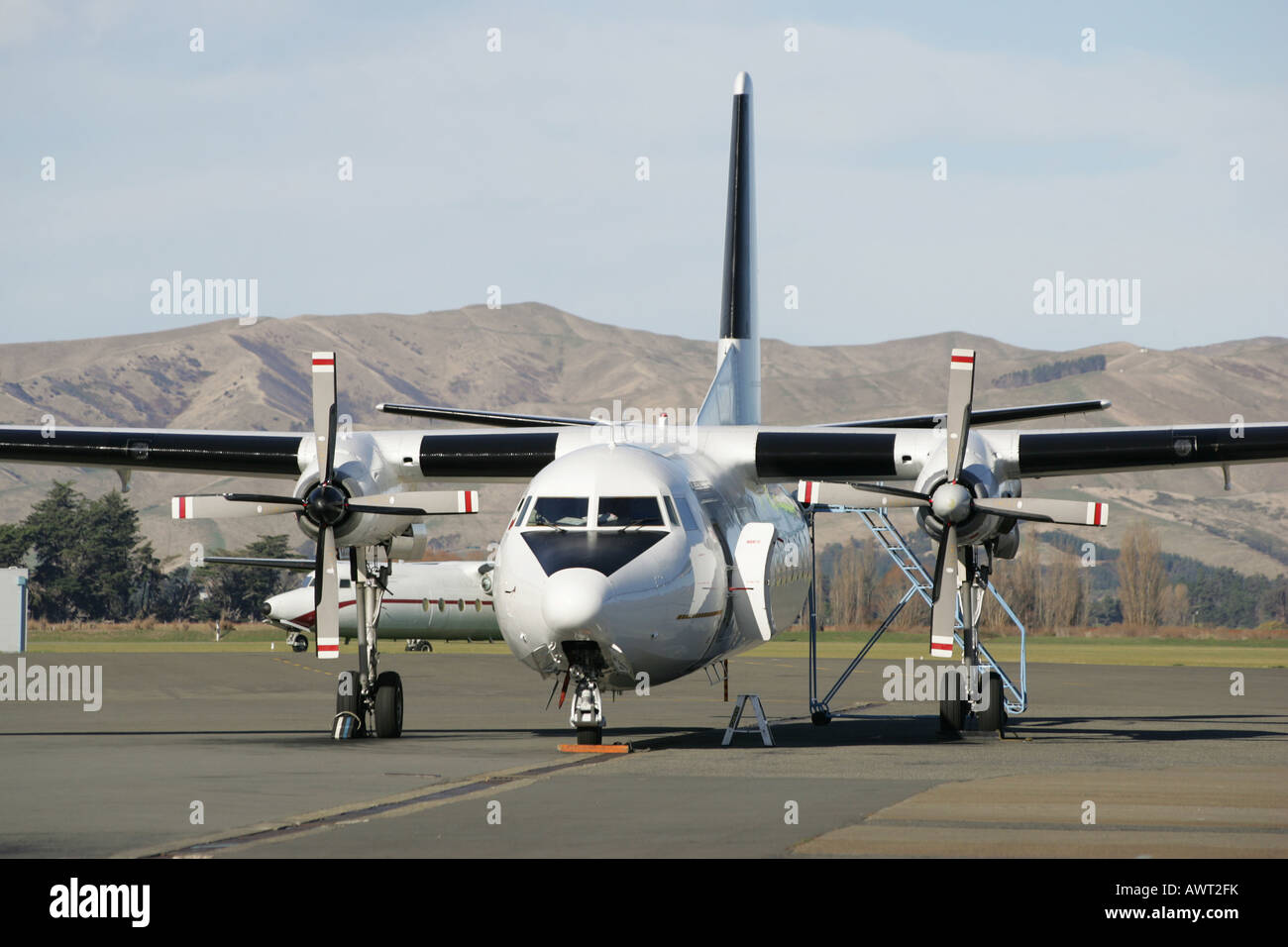 A propeller-driven airliner awaiting new passengers Stock Photo - Alamy