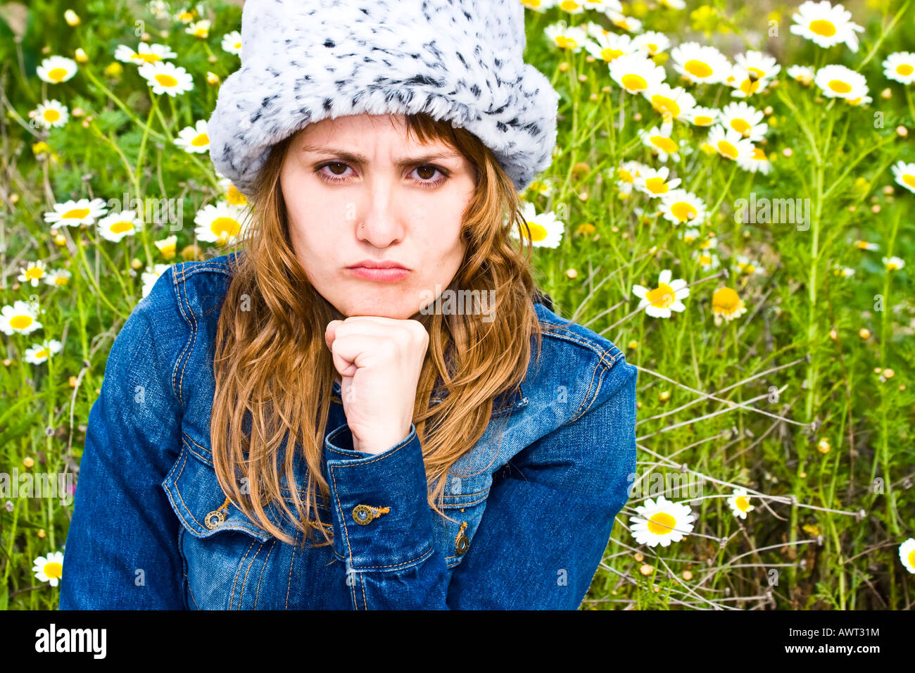 Angry woman over spring background Stock Photo - Alamy