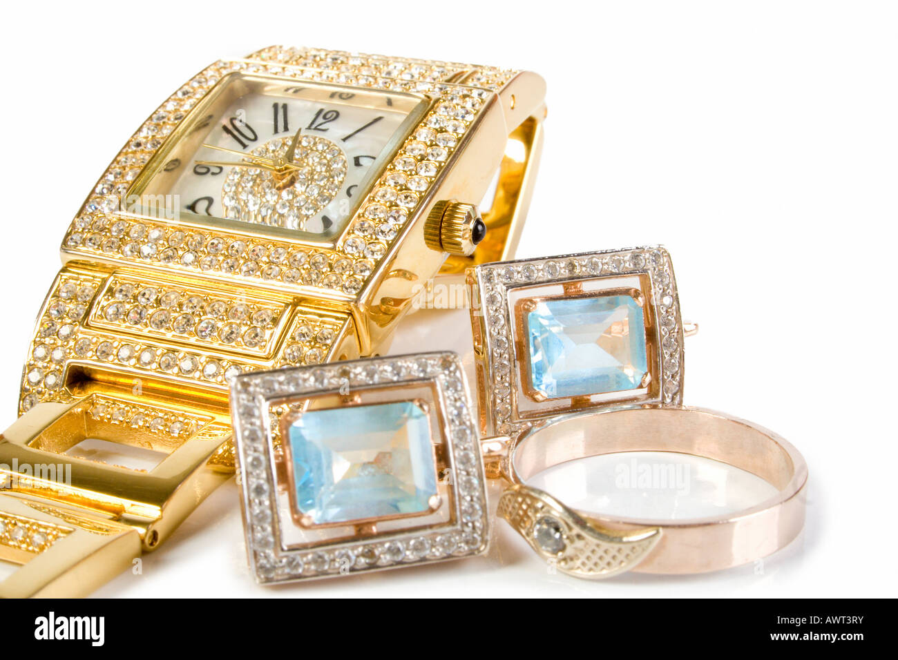 Golden clock and jewellery Stock Photo - Alamy