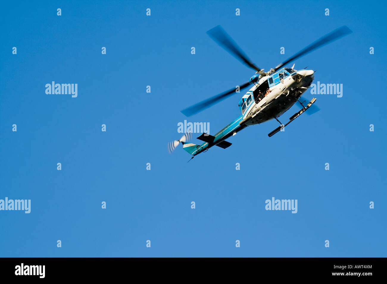 Helicopter on a dark blue sky. Horizontal shot Stock Photo - Alamy