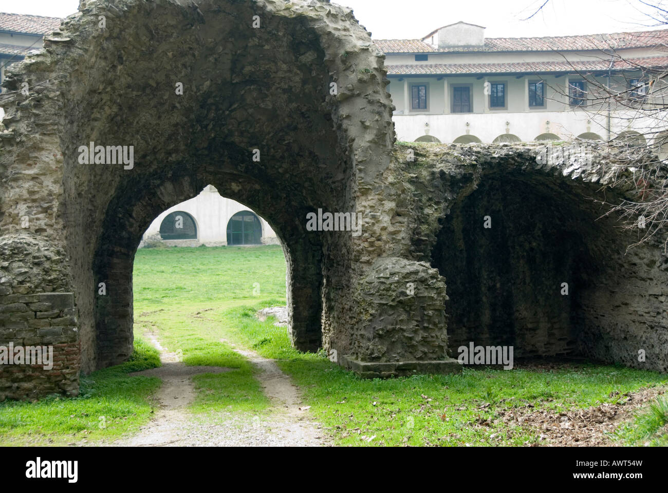 Arch of the Amphitheatre in Arezzo with the Archaeological museum in ...