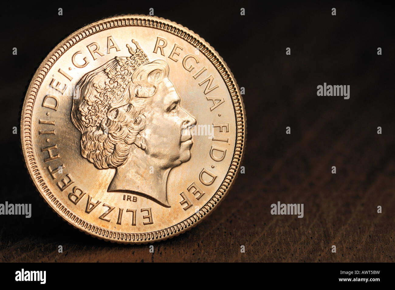 British Gold Sovereign on mahogany Stock Photo - Alamy