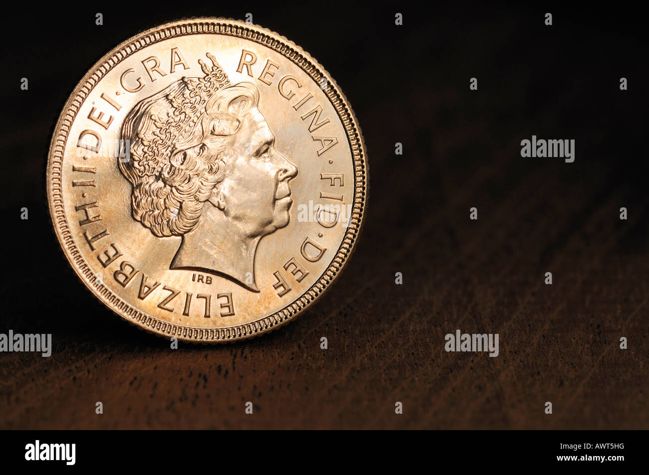 British Gold Sovereign on mahogany Stock Photo - Alamy