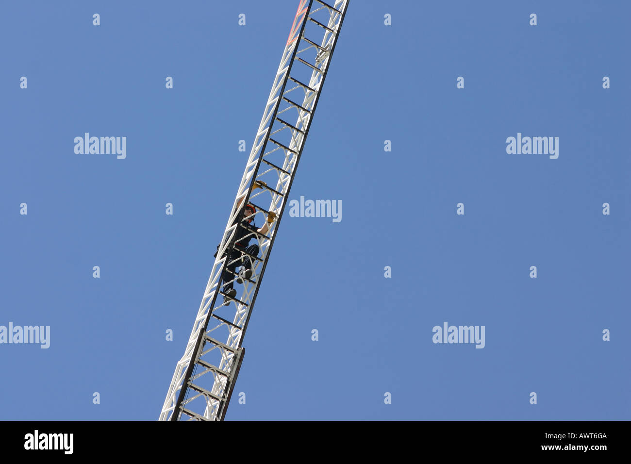 Fireman climbing a ladder Stock Photo - Alamy