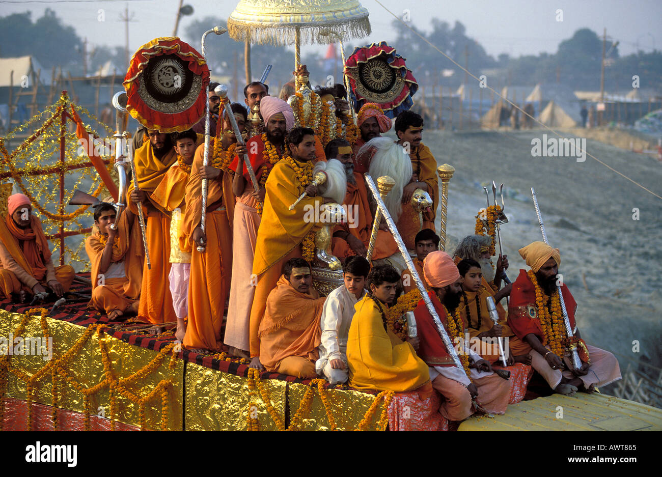 Indian guru is sits on an elevated platform with his close followers ...