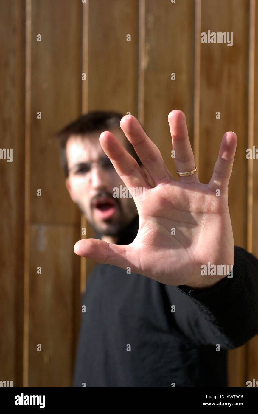 man stretching his arm hide face Stock Photo - Alamy